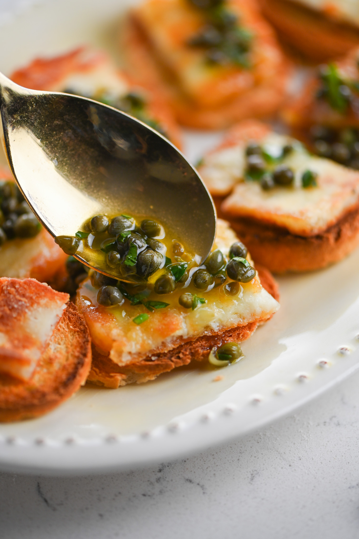 Fried Halloumi Crostini with Lemon Caper Oil - Life's Ambrosia